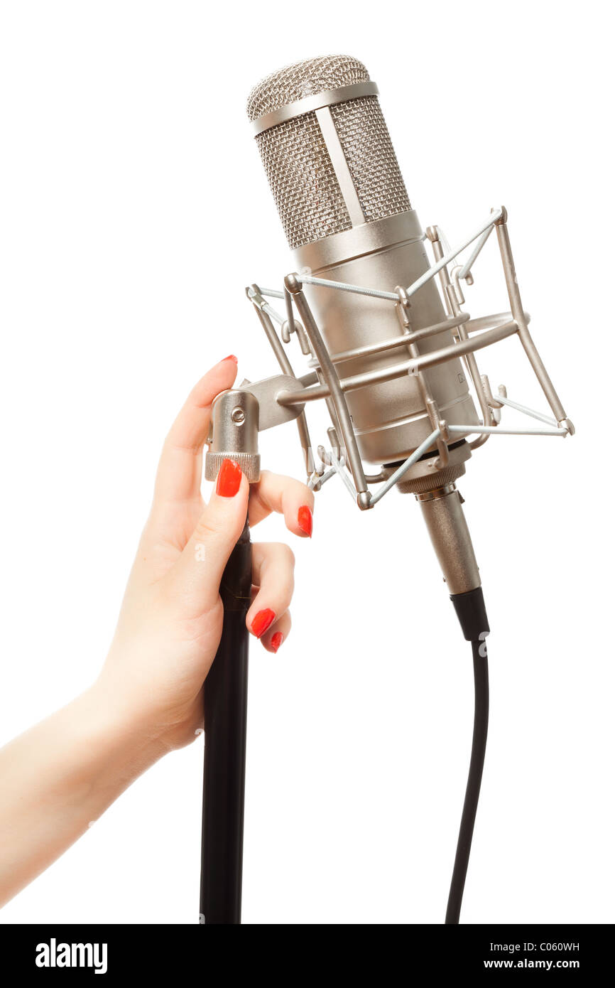 Woman's hand with red nails holding microphone stand Stock Photo - Alamy