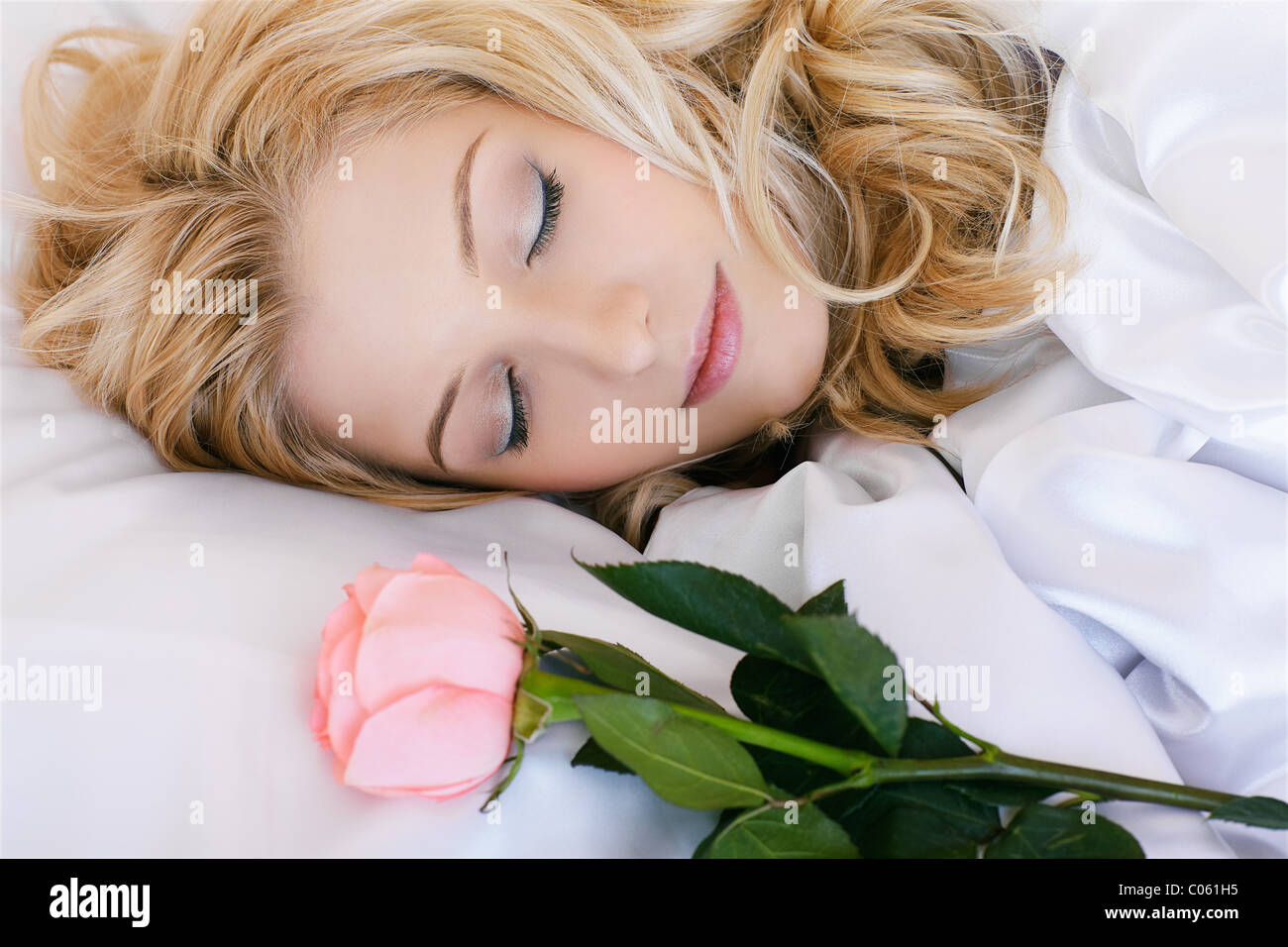sleeping girl with rose Stock Photo - Alamy