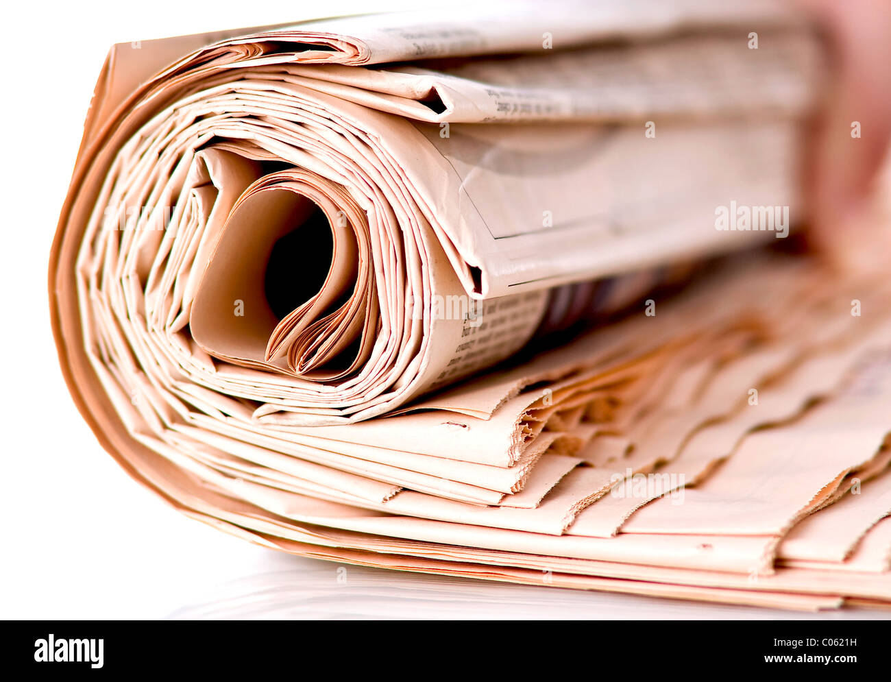 Roll of News papers isolated on white background Stock Photo - Alamy