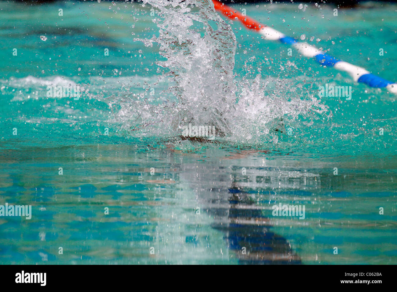 Splash of water as swimmer competes in gala at sports day at school ...