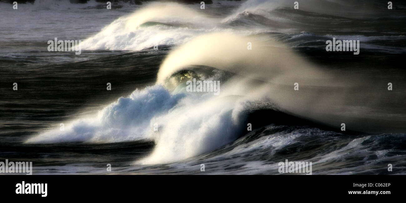crashing waves sea water spray Stock Photo - Alamy