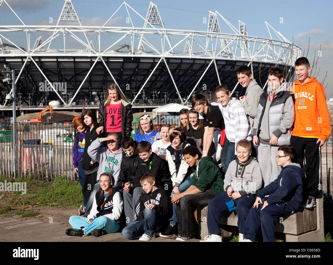 Children visiting Olympic Stadium pose for photograph, London Stock ...