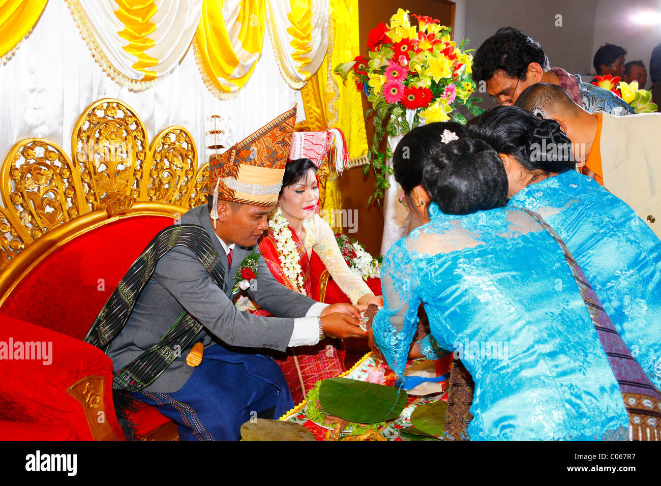 Bride and groom are served food, wedding ceremony, Siantar, Batak ...