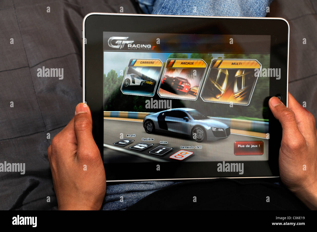 boy play GT Racing with Apple iPad,tablet computer Stock Photo - Alamy