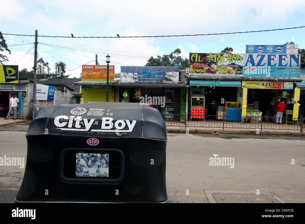 Advertisement for the military on an auto rickshaw parked in the street ...