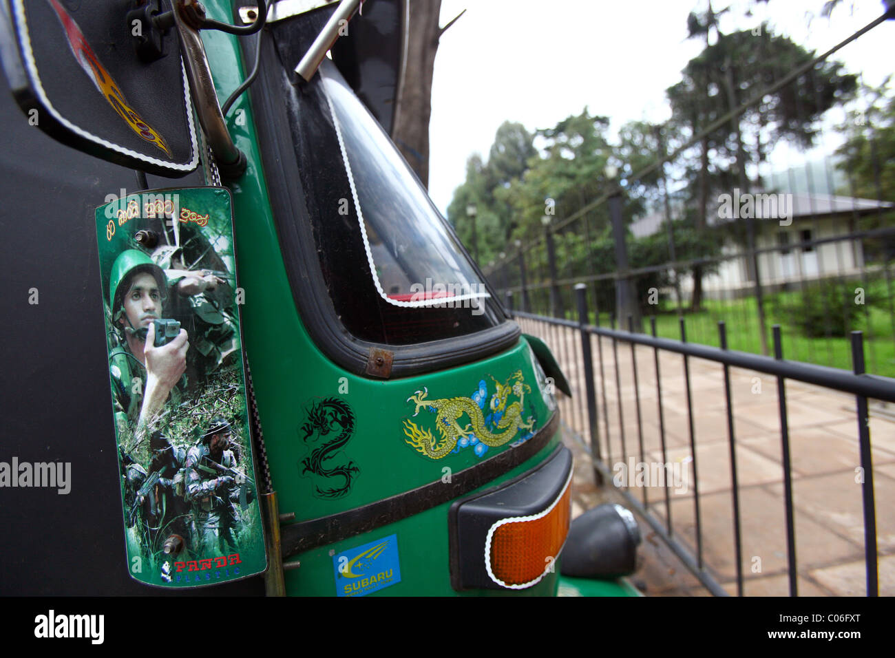 Advertisement for the military on an auto rickshaw parked in the street ...