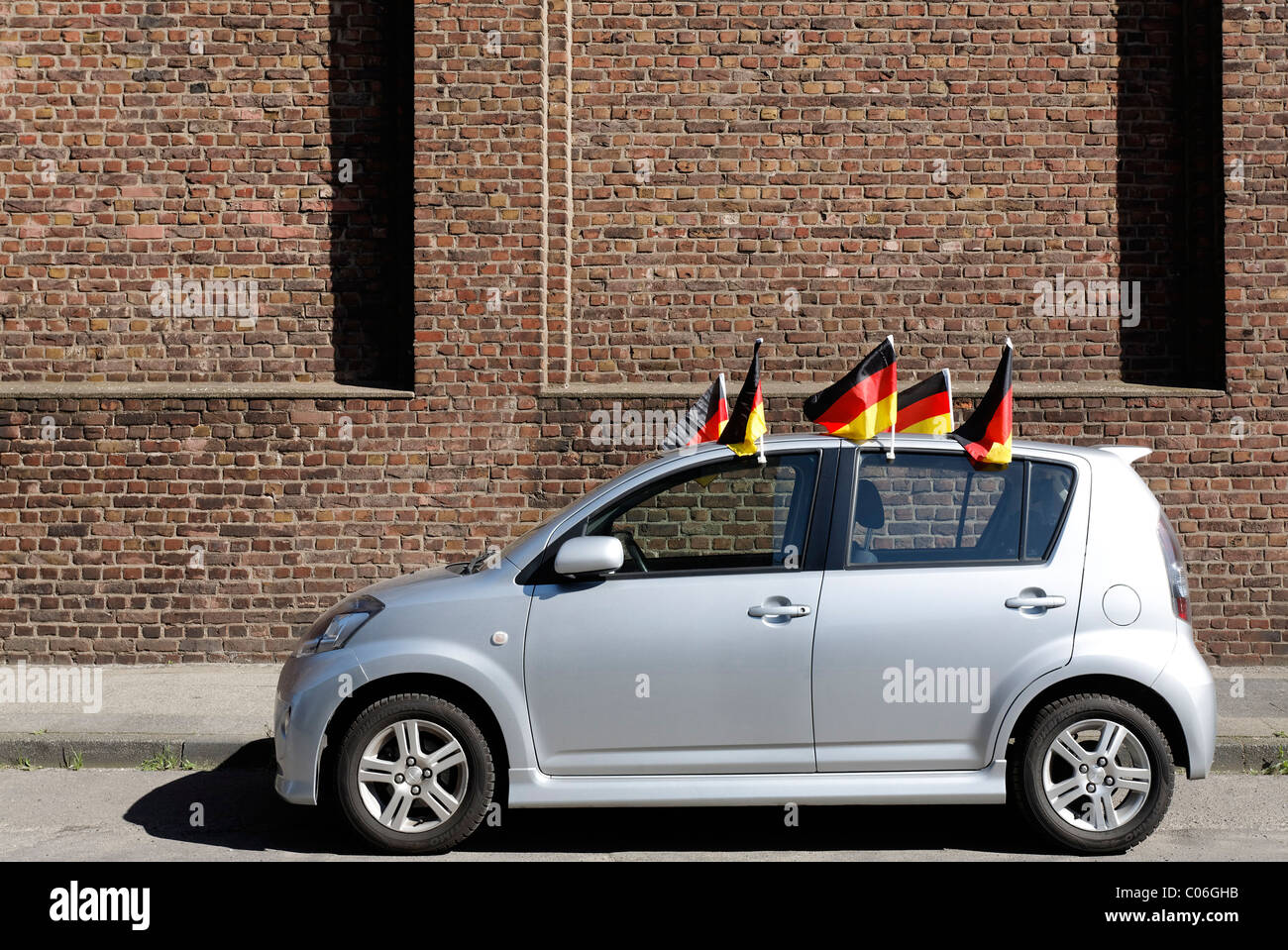 Small car decorated with five Germany flags, World Cup, Krefeld ...