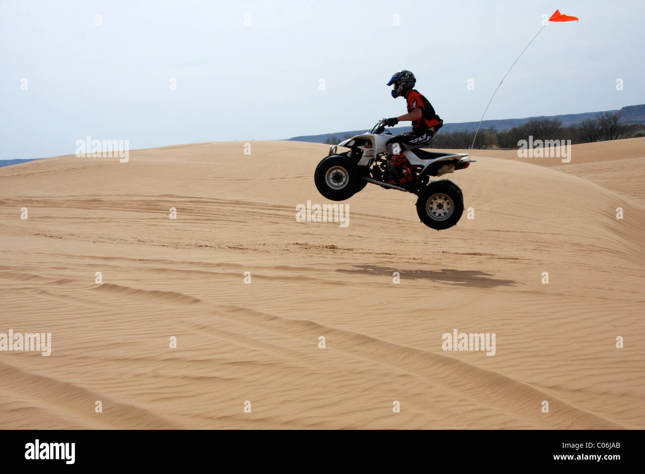 boy riding 4 wheeler in the sand Stock Photo - Alamy