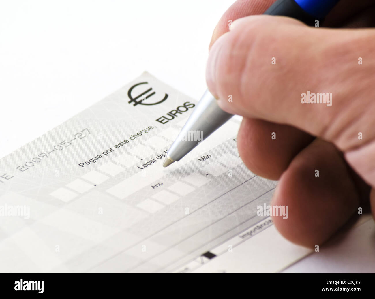 hand signing a check Stock Photo - Alamy
