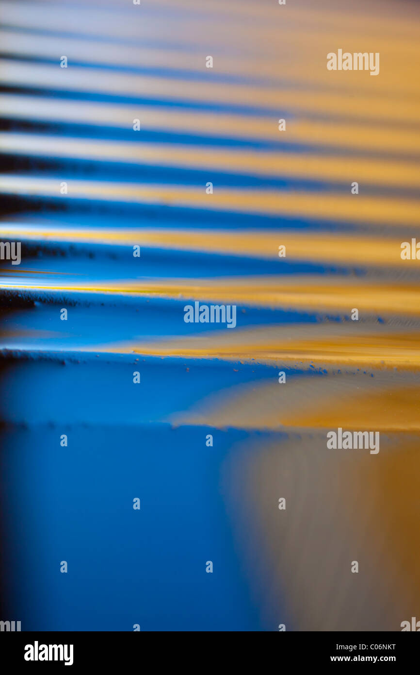 Colourful reflection of the sunset on wet surface Stock Photo - Alamy