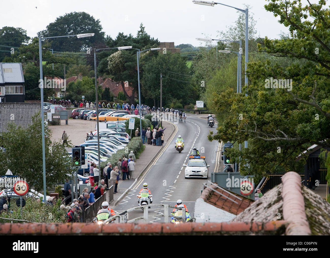 Tour of Britain cyclists approach Wroxham Bridge Stock Photo - Alamy