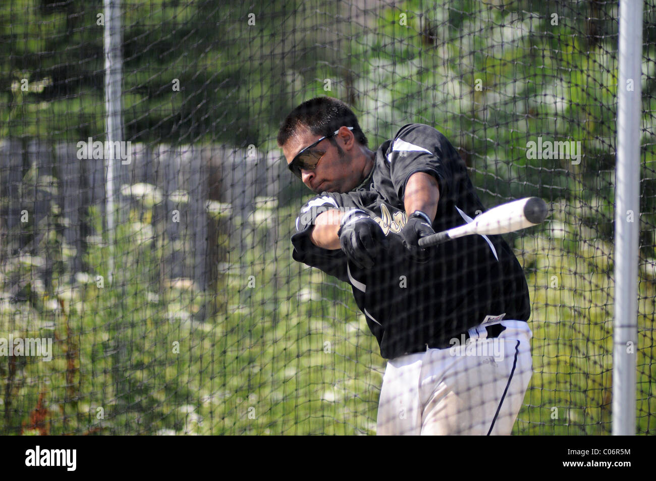 Hitting baseball cage hi-res stock photography and images - Alamy