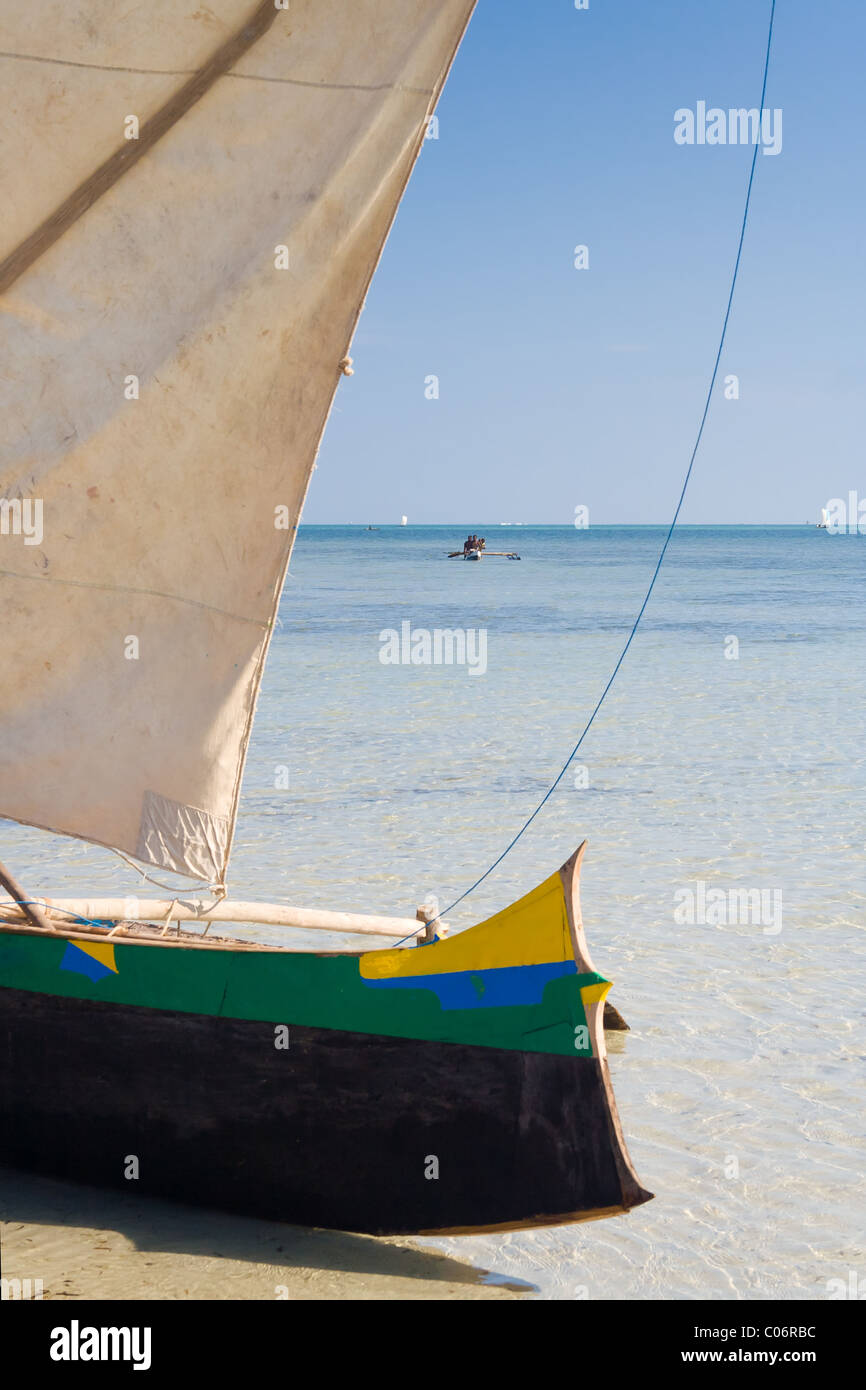 Malagasy outrigger pirogue with makeshift sails Stock Photo - Alamy