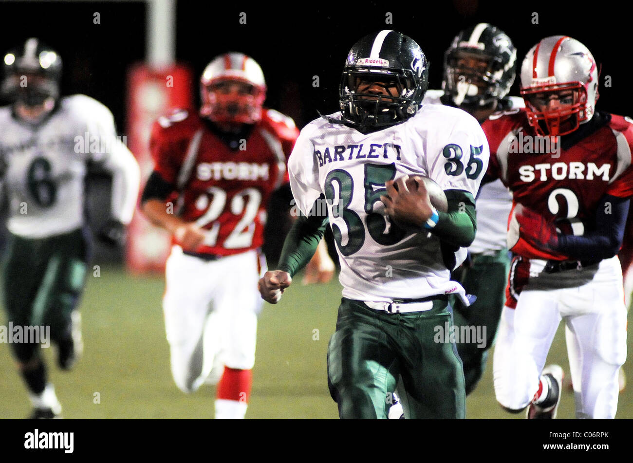 Football, High School Player brakes into the open on a kickoff return ...