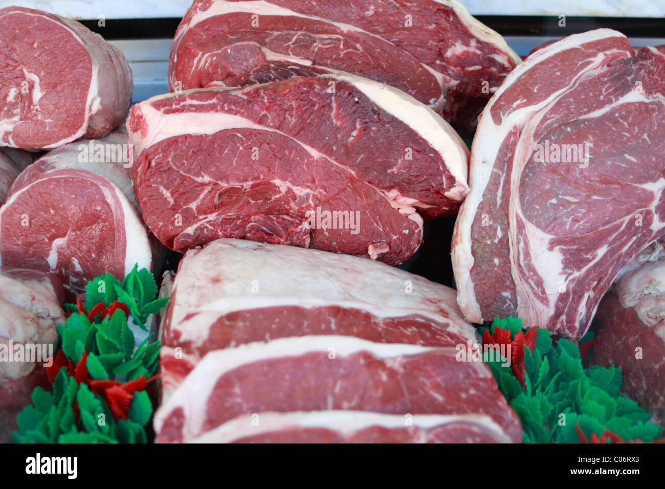 fresh meat on display in butchers shop Stock Photo - Alamy