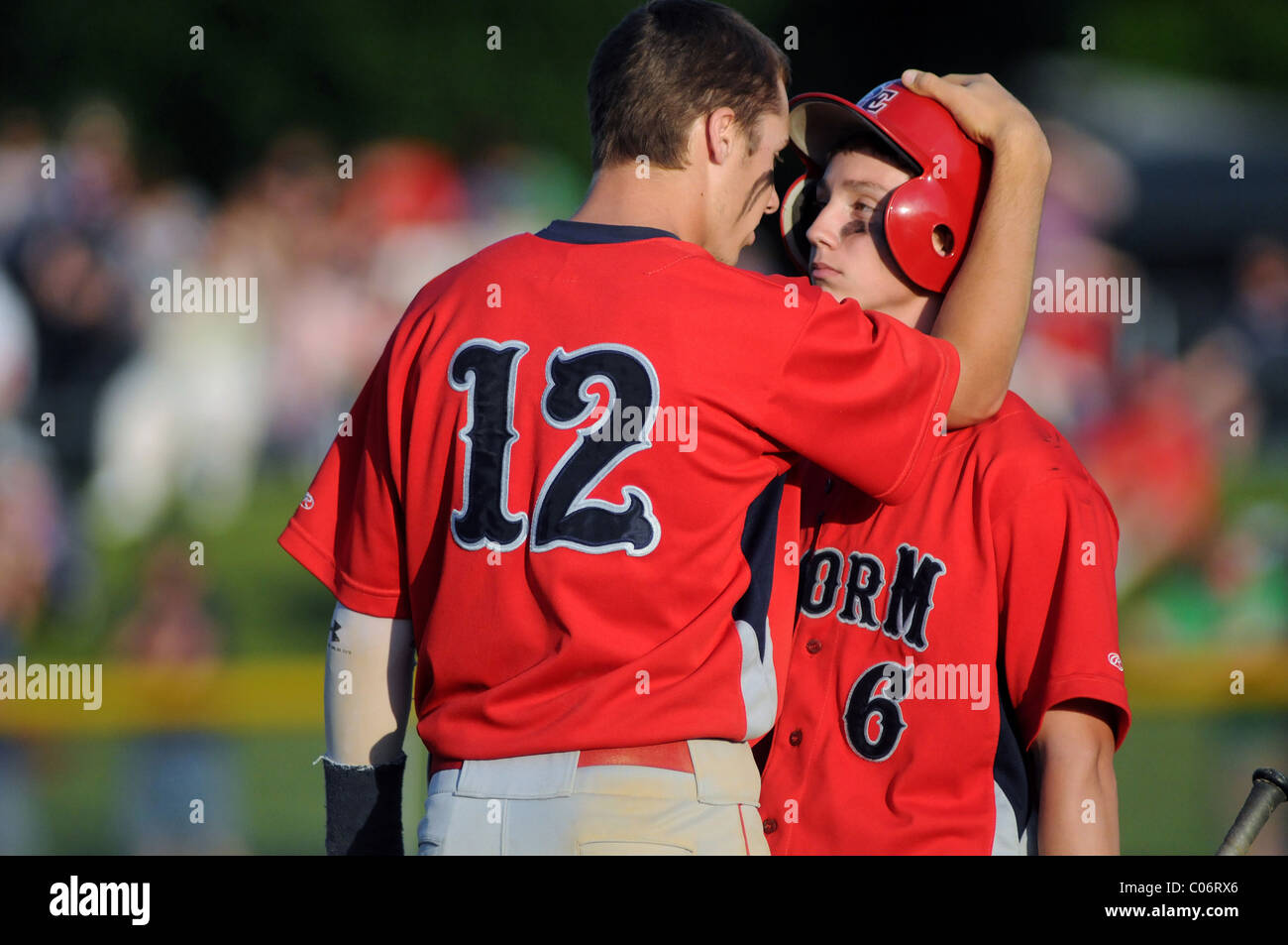 Player emphatically encourages teammate and impending hitter during a ...