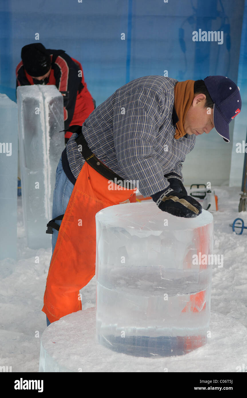 Teams of professional ice carvers work together to build massive ice ...
