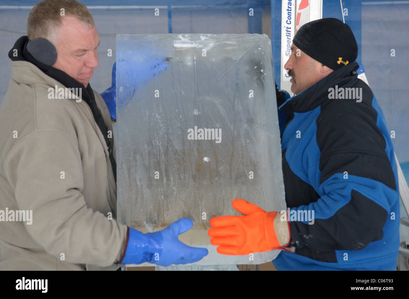 Teams of professional ice carvers work together to build massive ice ...