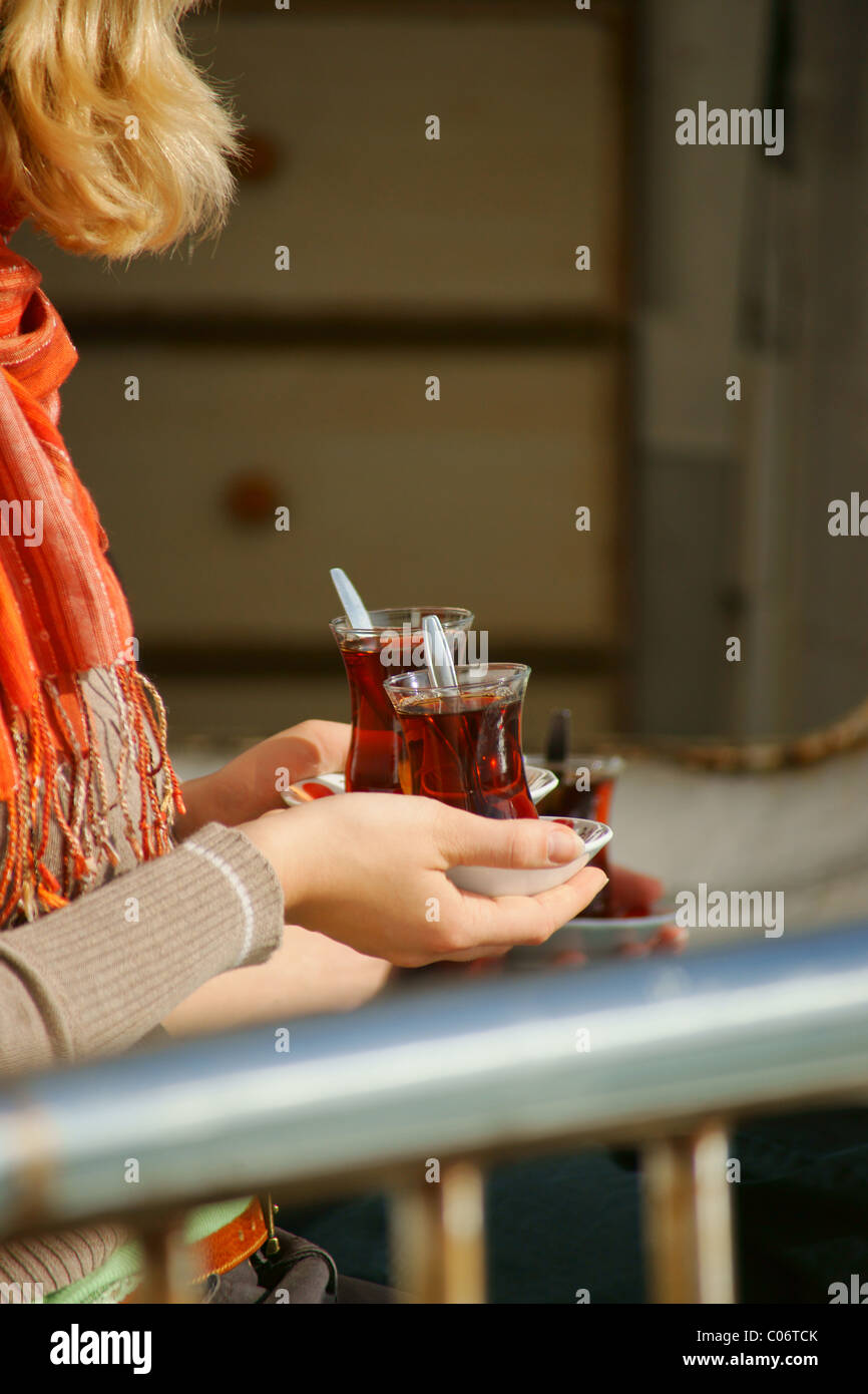 Lady serving tea Stock Photo - Alamy