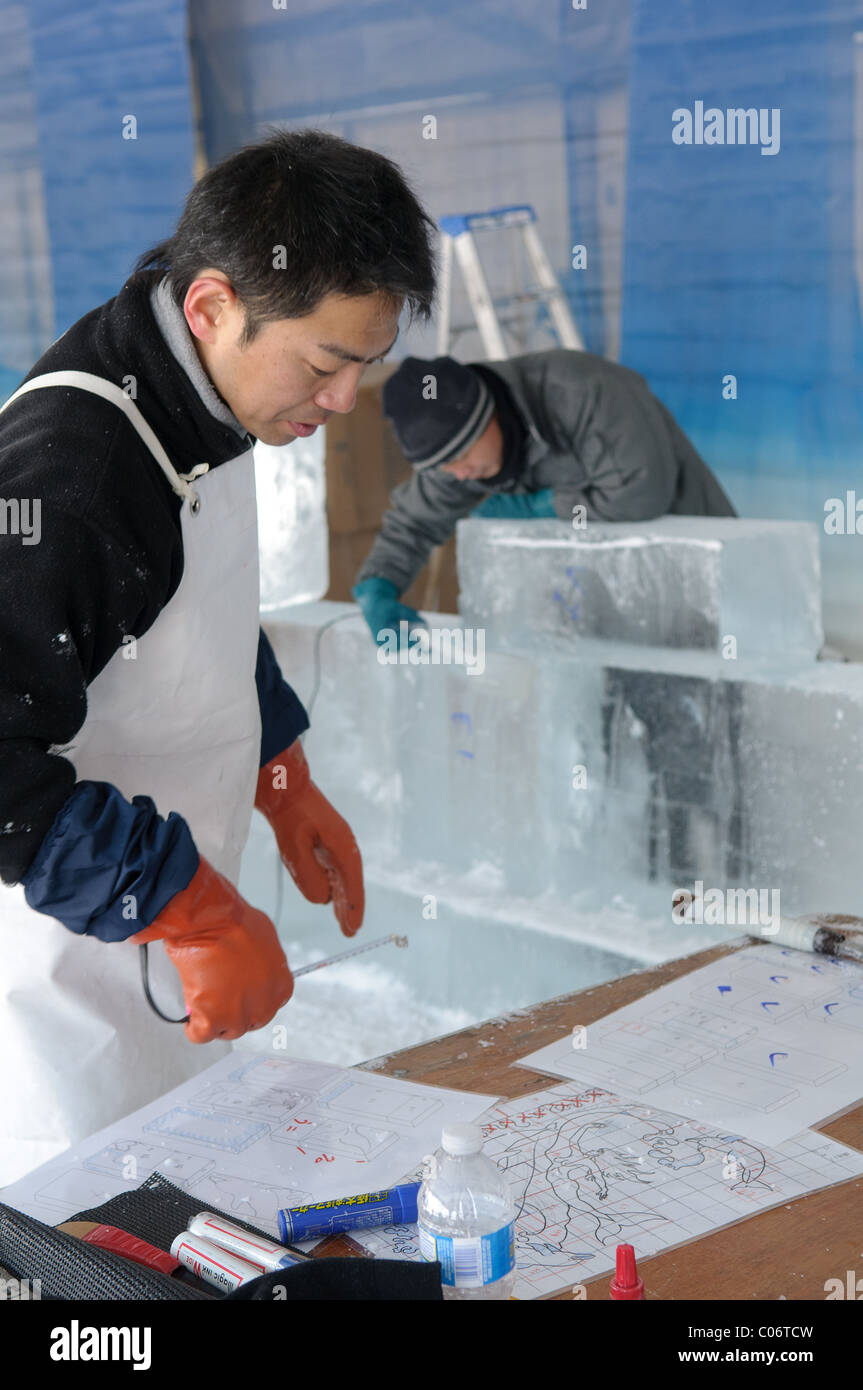 Teams of professional ice carvers work together to build massive ice ...