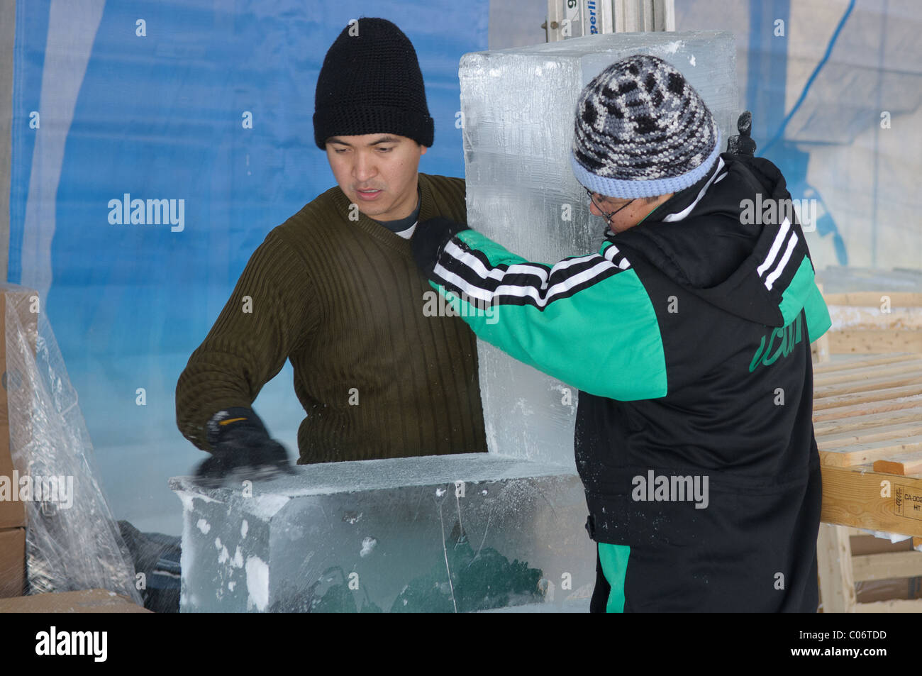 Teams of professional ice carvers work together to build massive ice ...