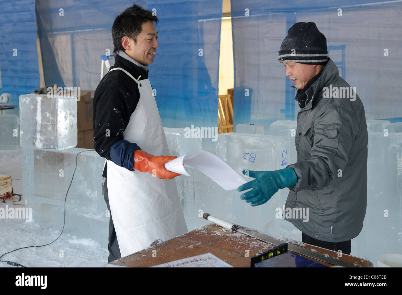 Teams of professional ice carvers work together to build massive ice ...