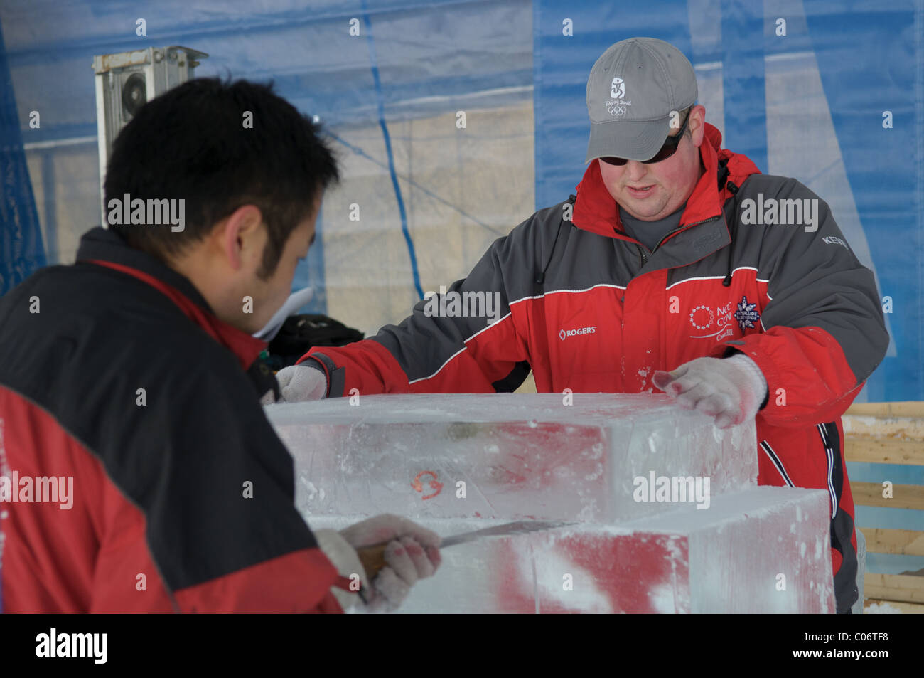 Teams of professional ice carvers work together to build massive ice ...