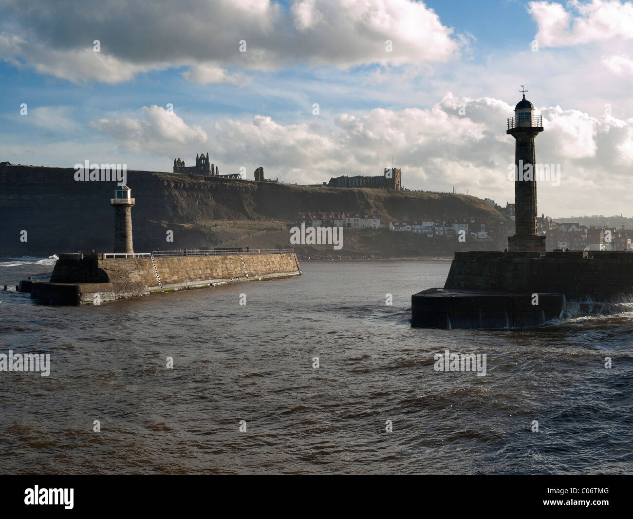 The entrance to Whitby Harbour at high tide in afternoon light Stock ...