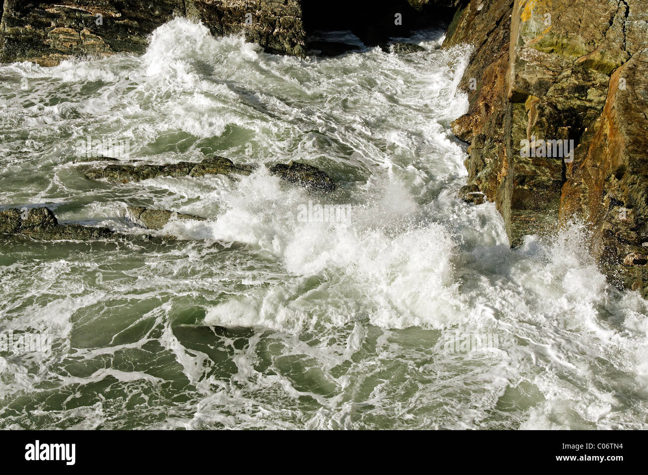 Breaking waves in Mousetrap Zawn, Anglesey Stock Photo - Alamy