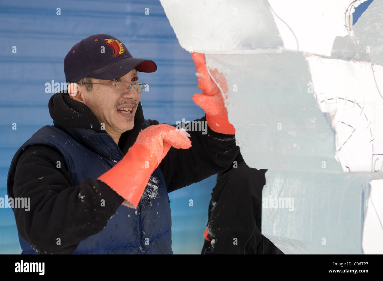 Teams of professional ice carvers work together to build massive ice ...