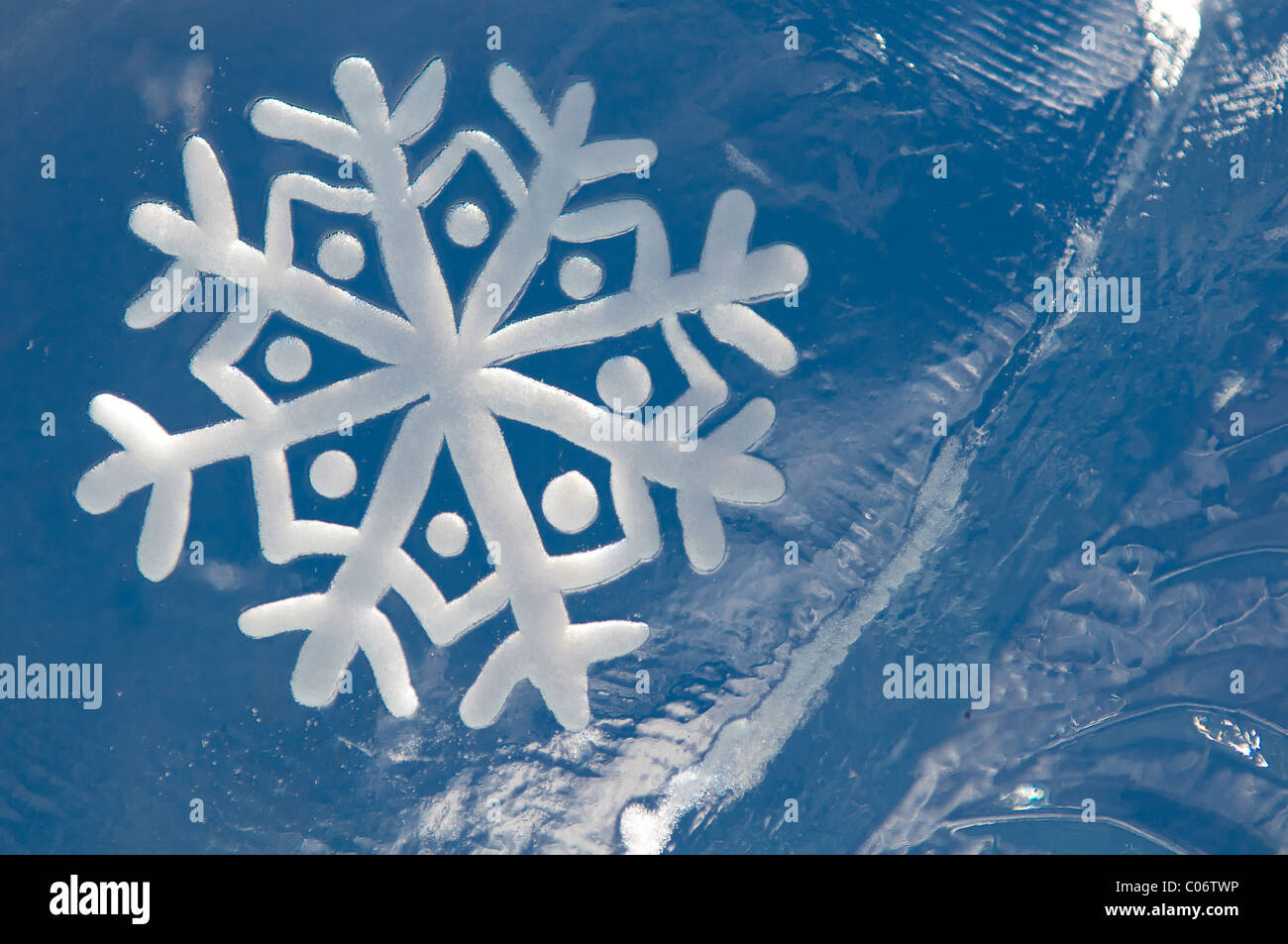 A large snowflake graphic carved into a block of ice during Winterlude ...