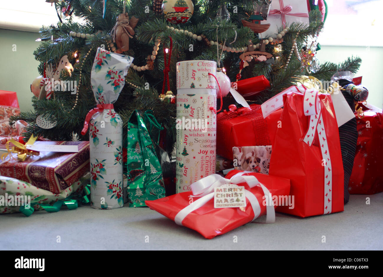 Presents around the Christmas tree Stock Photo - Alamy