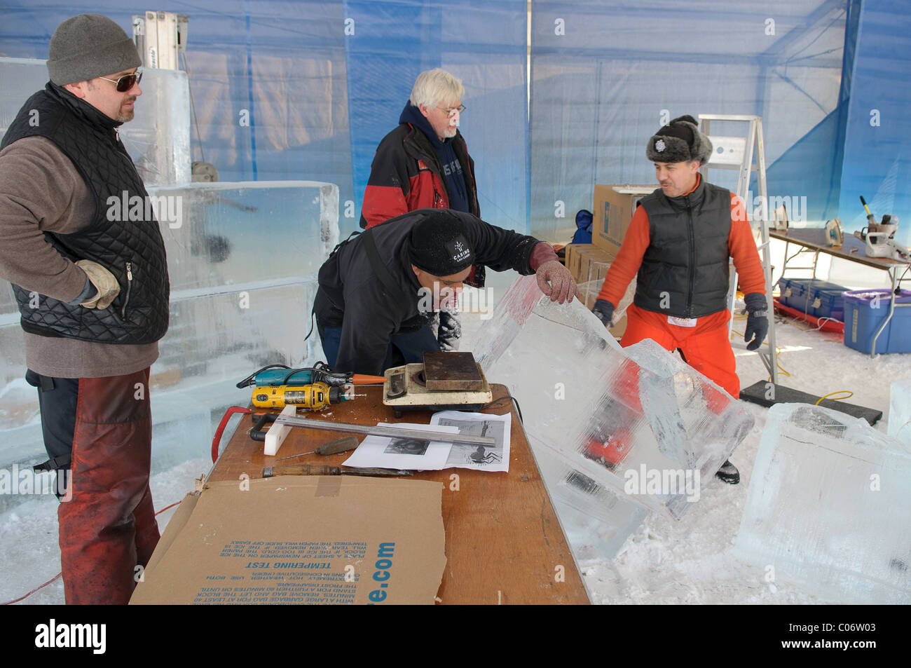 Teams of professional ice carvers work together to build massive ice ...