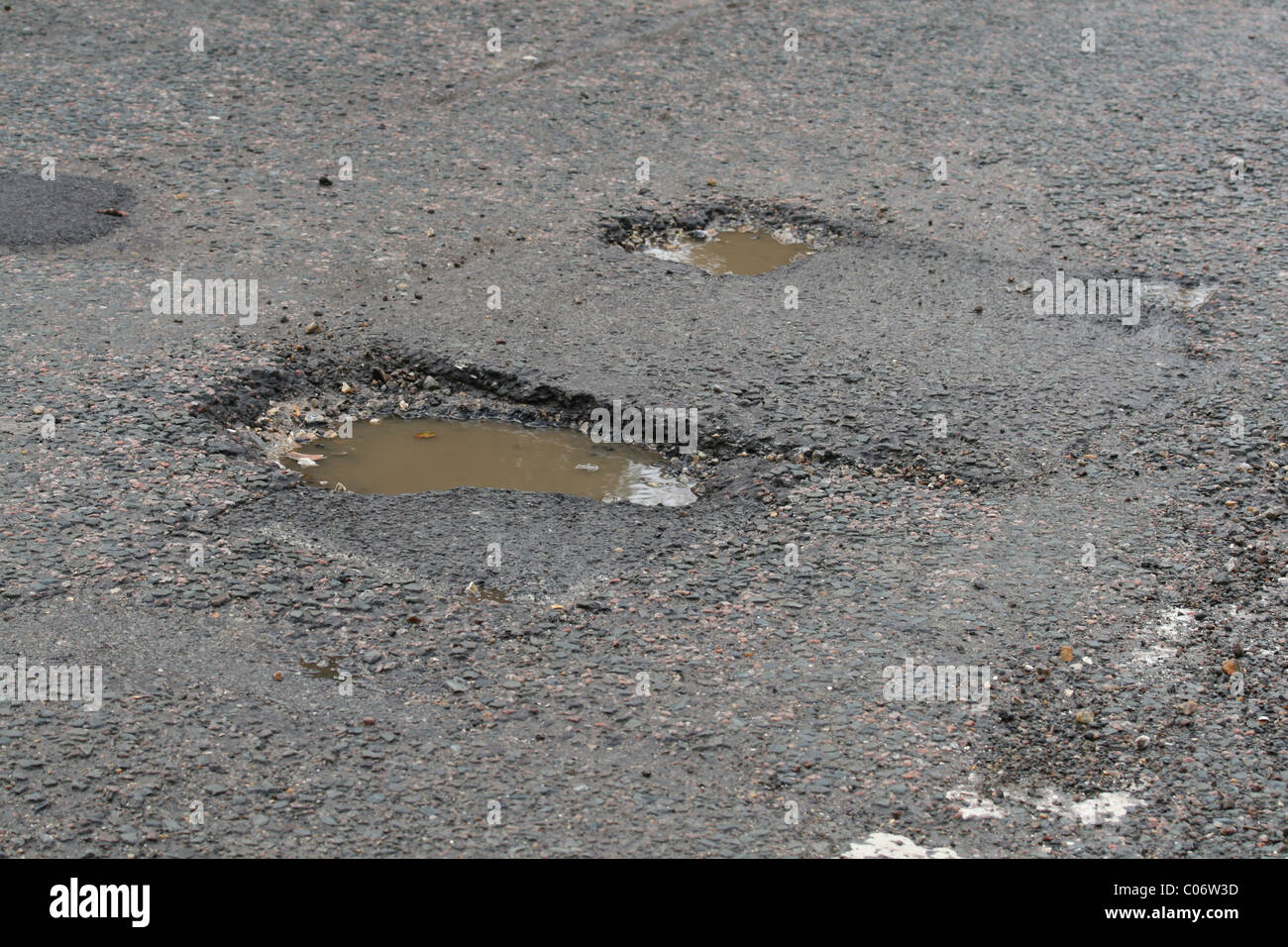 Potholes in road surface following hard winter Stock Photo - Alamy