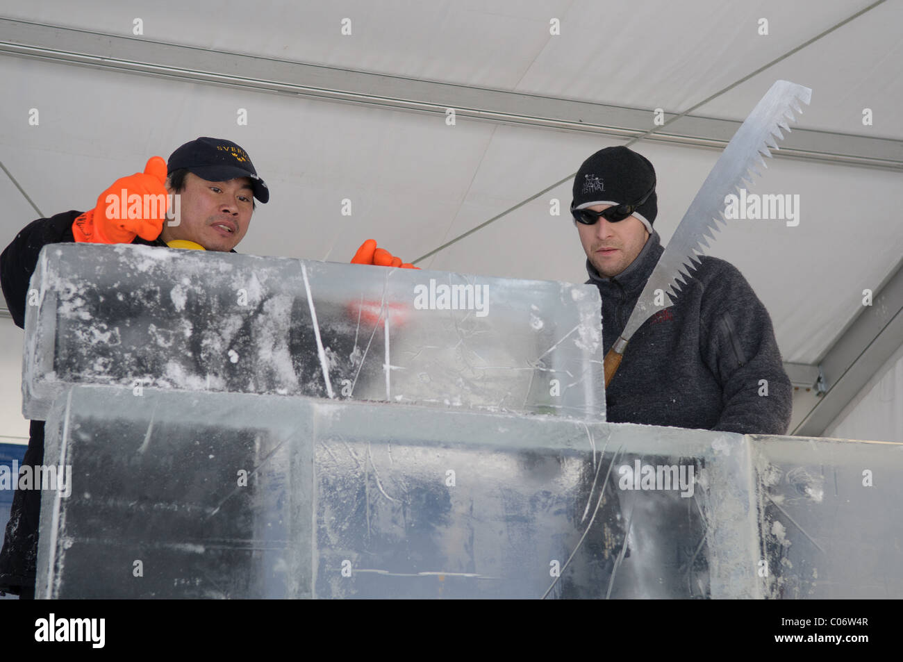 Teams of professional ice carvers work together to build massive ice ...