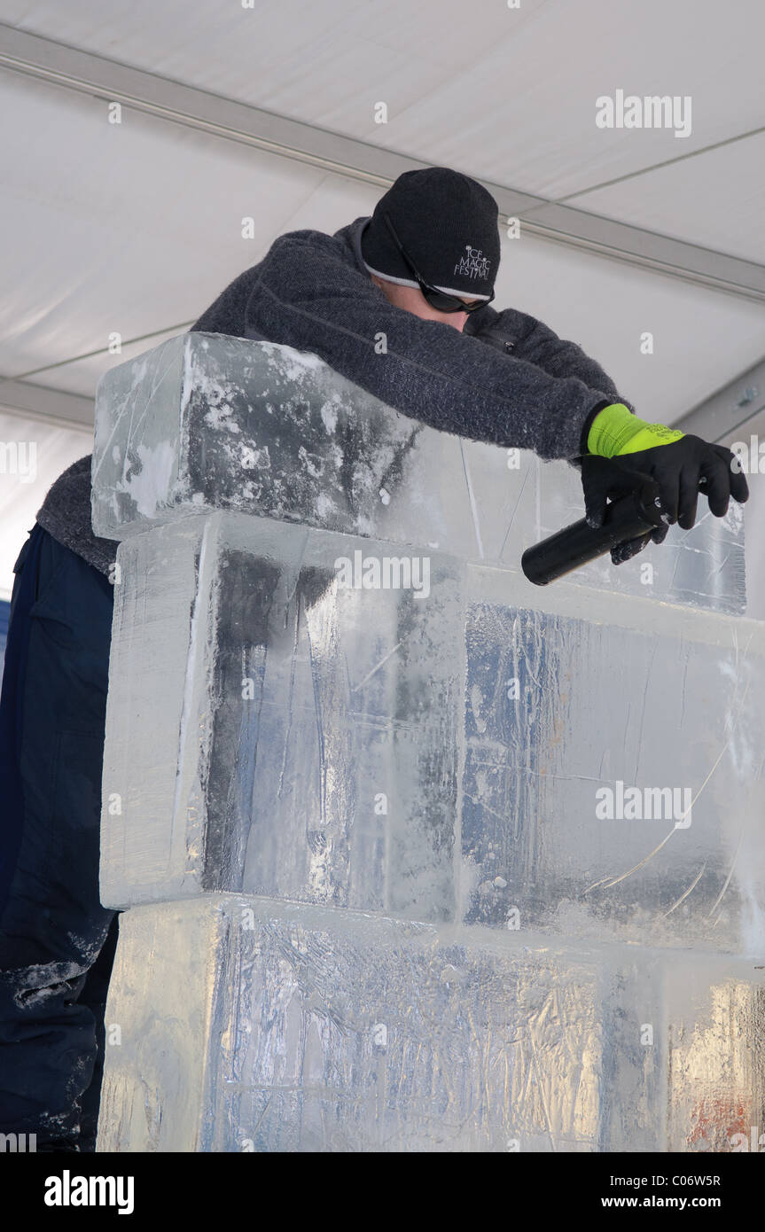 Teams of professional ice carvers work together to build massive ice ...