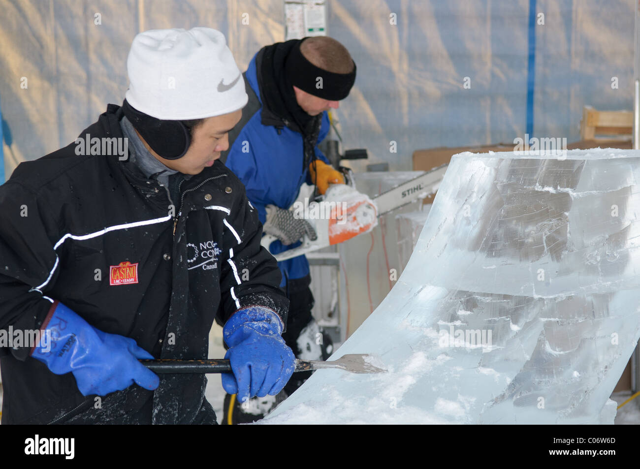 Teams of professional ice carvers work together to build massive ice ...