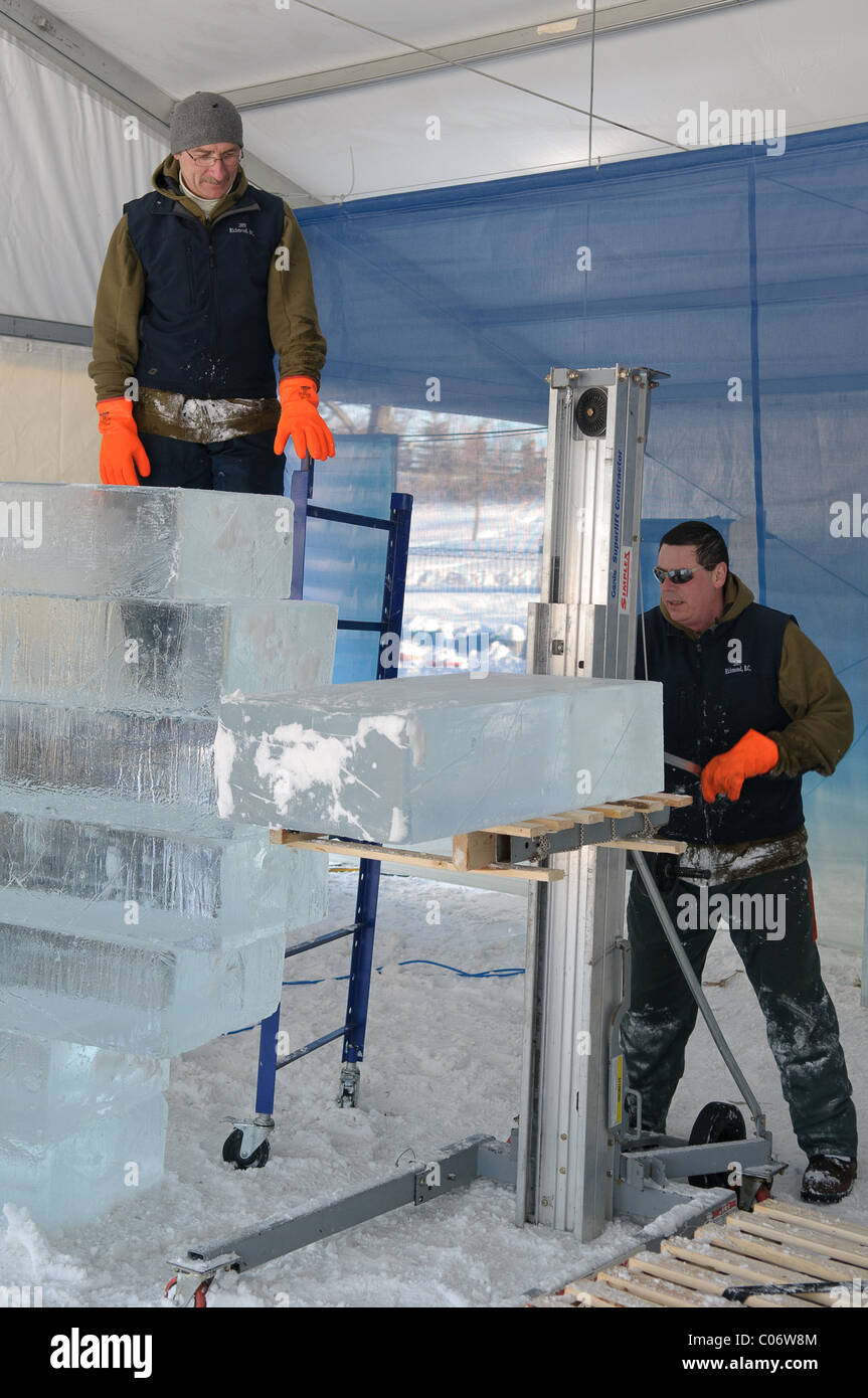 Teams of professional ice carvers work together to build massive ice ...