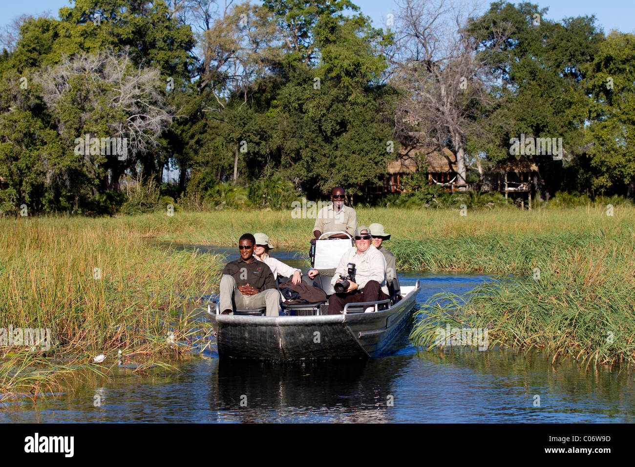 Photographers take boat ride with safari guides Stock Photo - Alamy