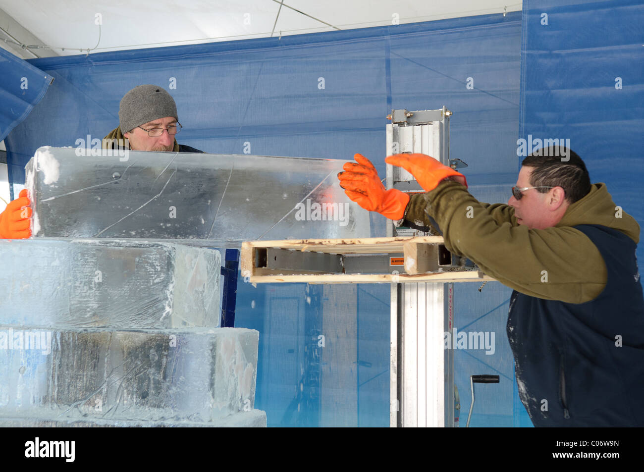 Teams of professional ice carvers work together to build massive ice ...