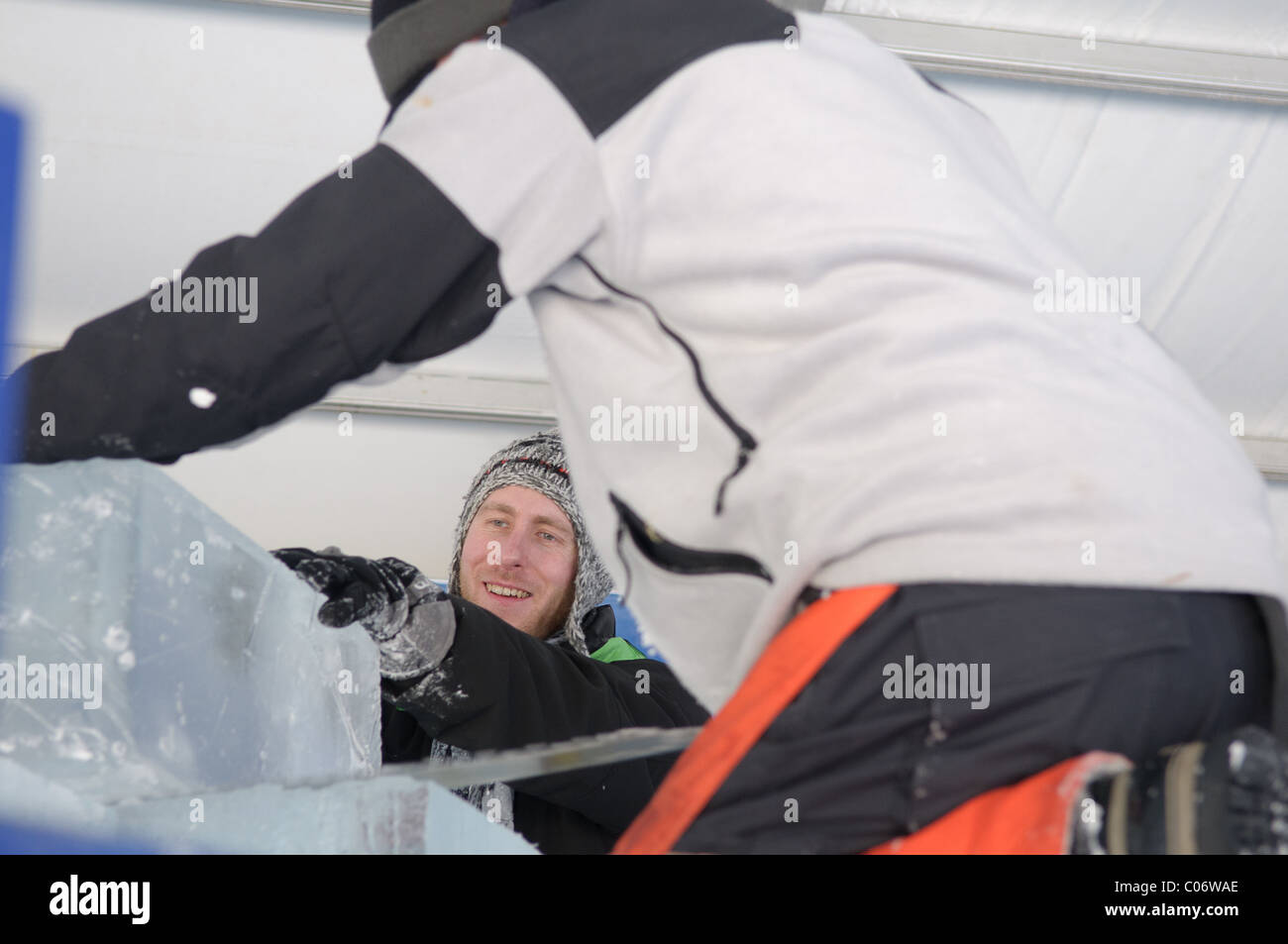 Teams of professional ice carvers work together to build massive ice ...