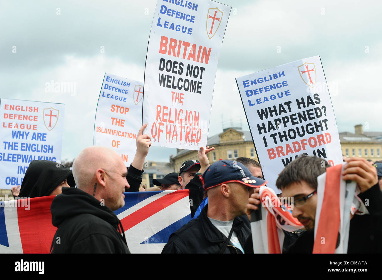 EDL supporters cheers and raise there banners Stock Photo - Alamy