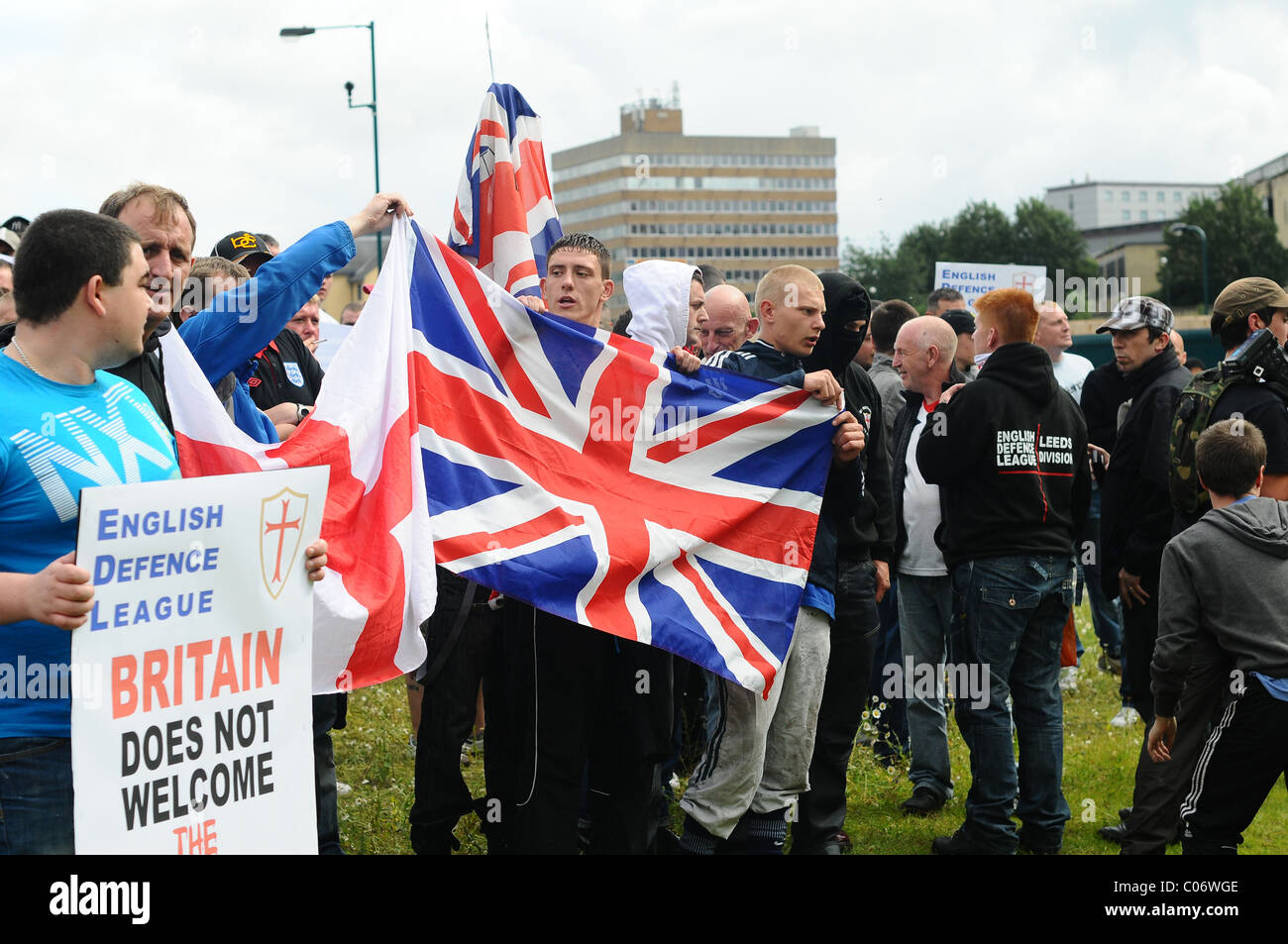 EDL supporters hold there flags and sing England songs Stock Photo - Alamy