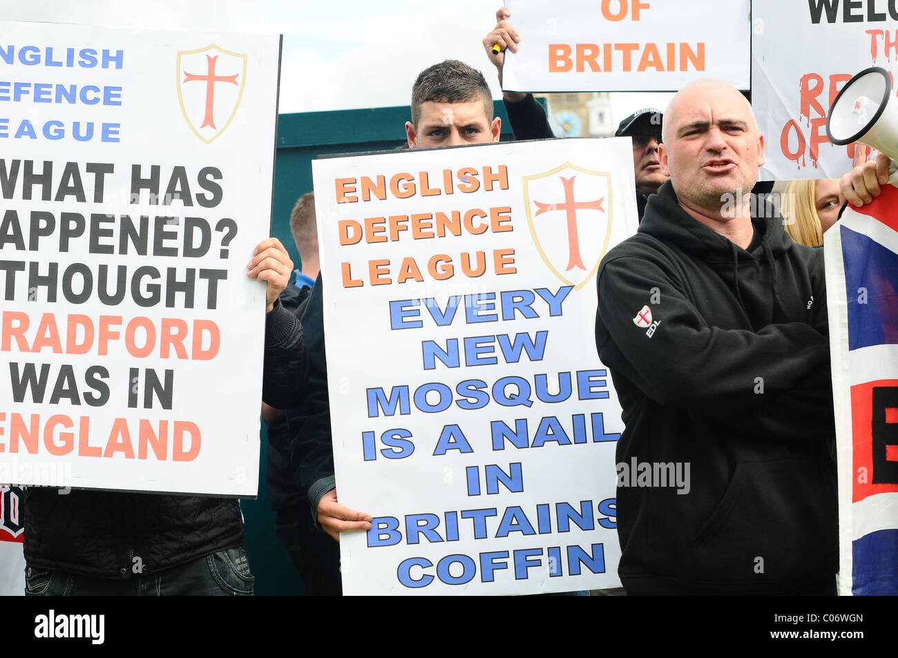 EDL supporters hold banners and sing England songs Stock Photo - Alamy