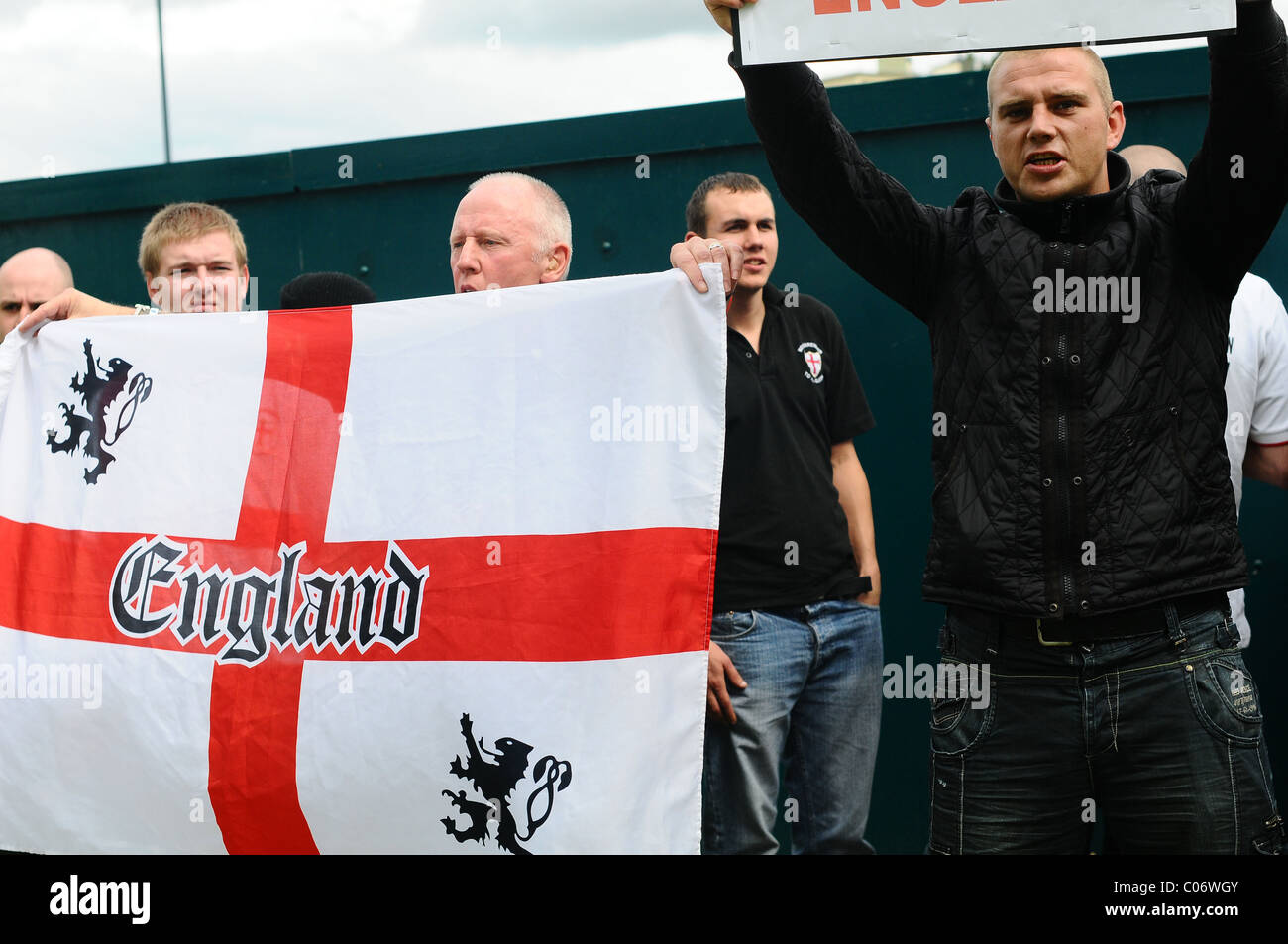 EDL supporters hold the England flag high showing support for the EDL ...