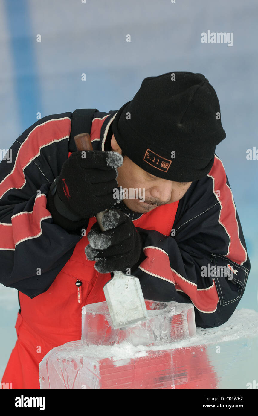 Teams of professional ice carvers work together to build massive ice ...
