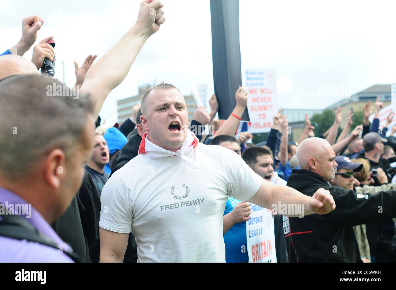 Police keep back the EDL supporters with the police line of officers ...