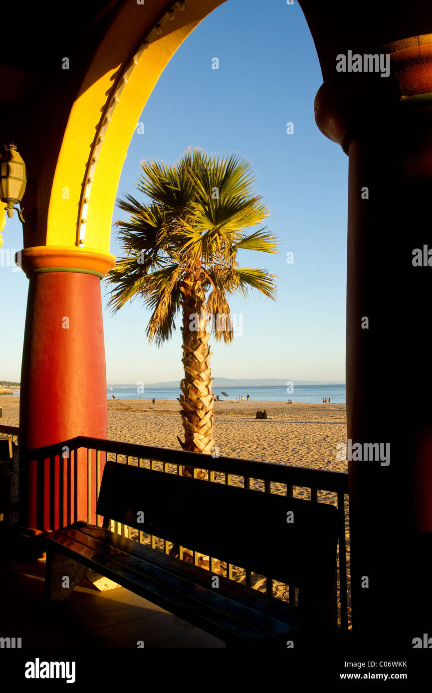 Palm tree and beach viewed through arch from the Boardwalk at Santa ...
