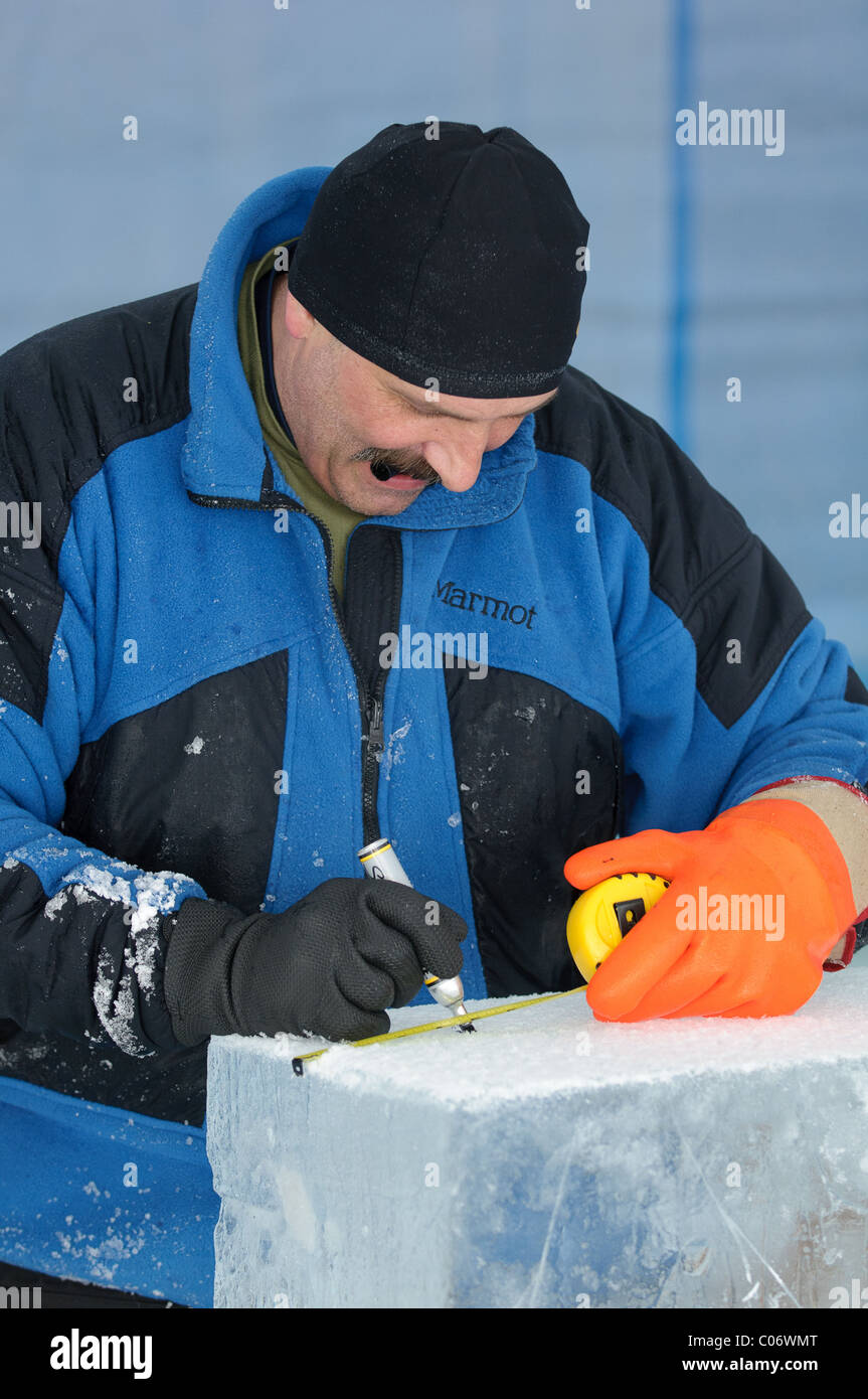 Teams of professional ice carvers work together to build massive ice ...
