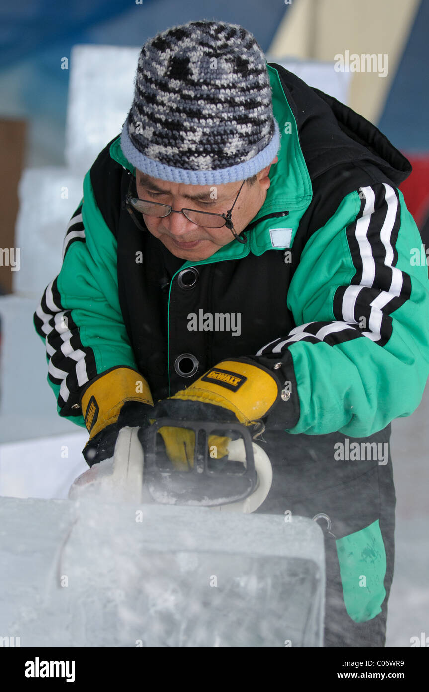 Teams of professional ice carvers work together to build massive ice ...